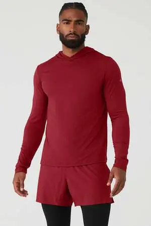 Alo Yoga Conquer Reform Long Sleeve With Hood Top In Victory Red